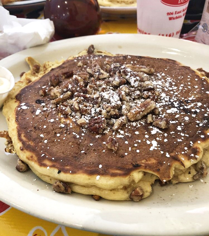 A pancake that's achieved perfect golden-brown status, topped with pecans that add just the right crunch. Breakfast nirvana achieved.