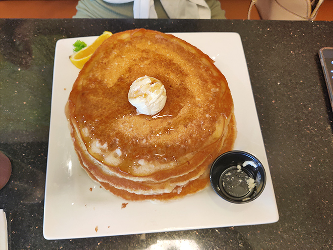 A pancake so perfectly golden and fluffy, it makes you wonder if clouds and sunshine somehow had a delicious breakfast baby.