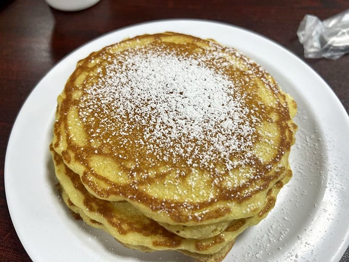 Classic pancakes dusted with powdered sugar &ndash; sometimes the simplest pleasures are the most satisfying. Maple syrup application is your artistic choice.