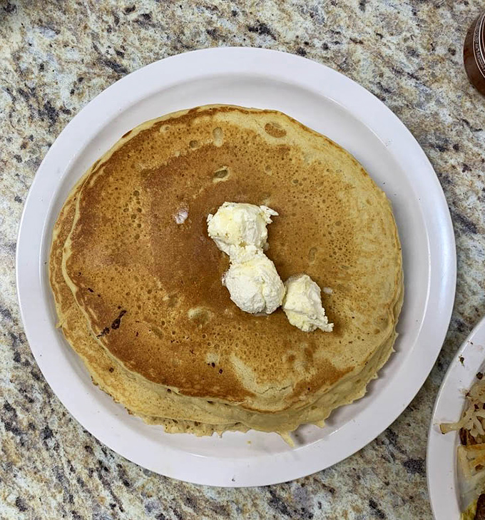 Golden-brown pancake perfection with a dollop of butter slowly melting into those fluffy layers&mdash;breakfast doesn't get more hypnotic than this.