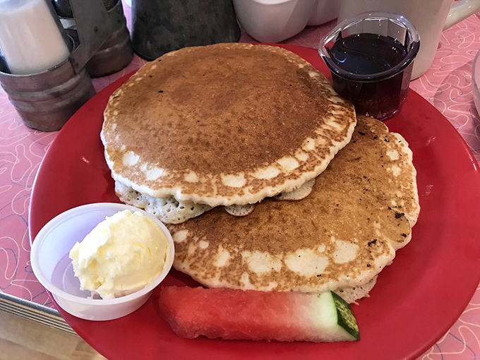 Pancakes so fluffy they practically hover above the plate. Add butter, pour syrup, and experience breakfast nirvana with a side of watermelon.