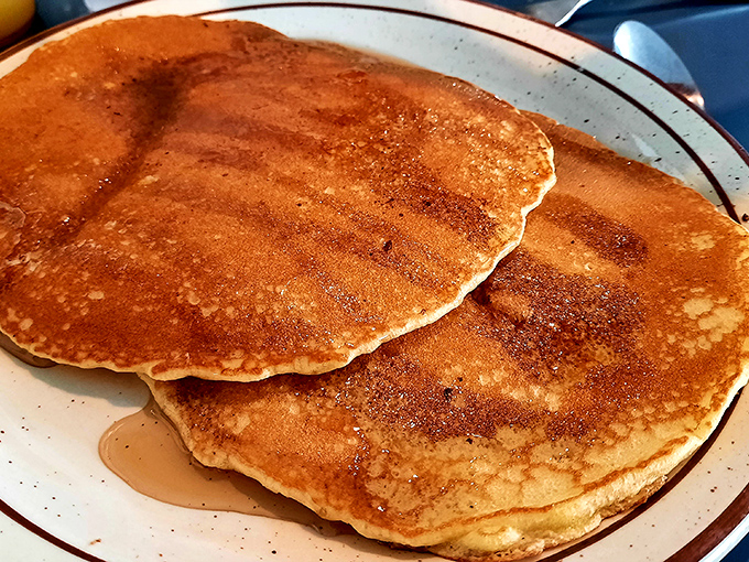 These pancakes aren't just golden brown – they're the color of childhood Saturday mornings and every perfect breakfast memory you've ever had.