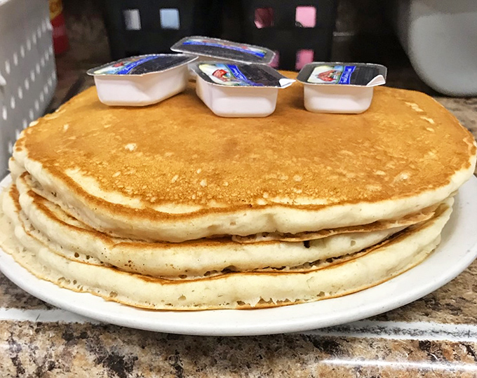 Stack of pancakes so generous, mathematicians would need calculators to measure the deliciousness per square inch.
