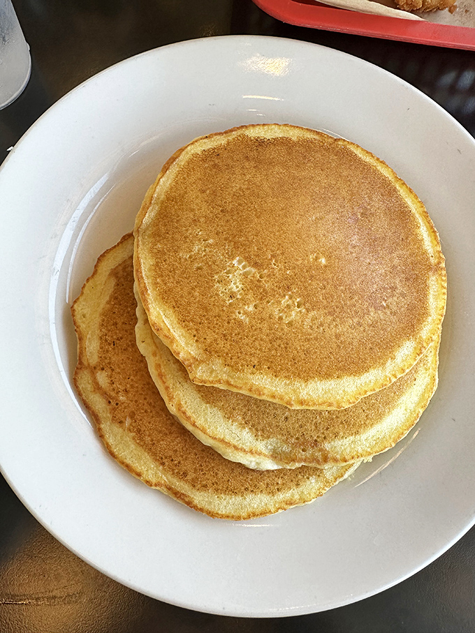 Pancakes stacked like golden vinyl records, each one a greatest hit of breakfast classics. No autotune needed for these chart-toppers.