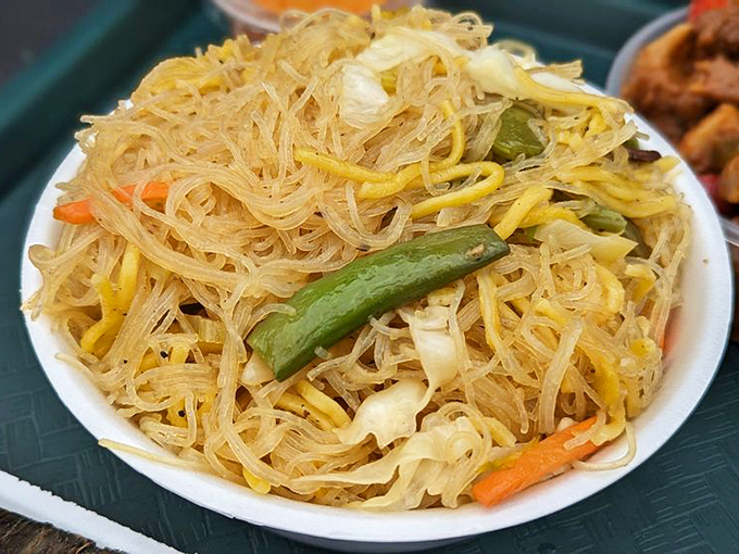 This isn't just noodles; it's pancit &ndash; a tangle of translucent vermicelli dancing with vegetables that puts your sad desk lunch to shame.