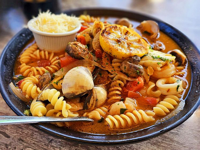 Seafood pasta that puts most Italian restaurants to shame. This isn't just dinner; it's a Mediterranean vacation in a bowl, no passport required.