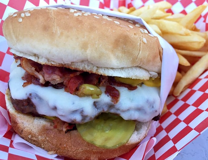 The Pastrami Burger &ndash; where two perfect foods decided life was better together. Those pickles aren't just garnish; they're essential supporting actors.