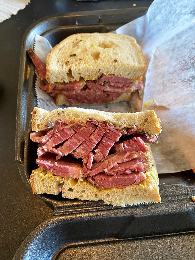The pastrami sandwich arrives stacked higher than your expectations, which is saying something in South Florida.
