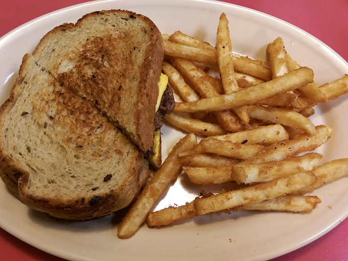 The patty melt and fries combo that makes you question why you'd ever waste calories on fancy food. Simple perfection on a plate.