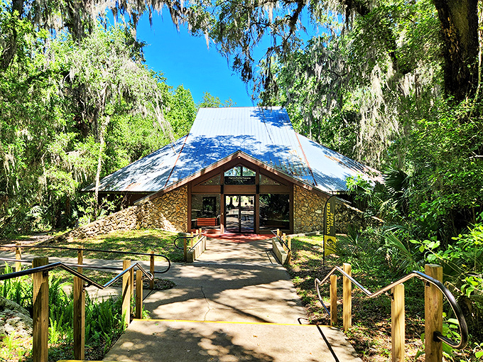The Paynes Prairie Visitor Center emerges from the wilderness like a rustic cathedral, its stone and timber frame honoring rather than intruding upon nature. 