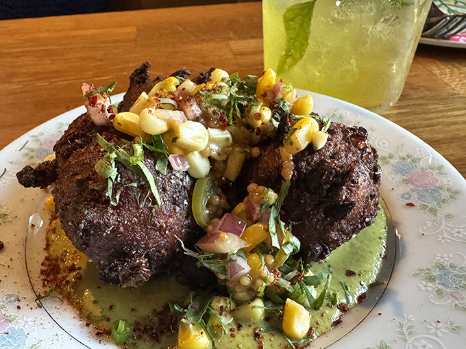 These fritters don't just sit on the plate&mdash;they command attention with their perfect crust and vibrant corn salsa topping.