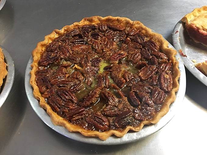 Pecan pie that looks like it should be in a museum—if museums allowed visitors to devour the exhibits with a fork.