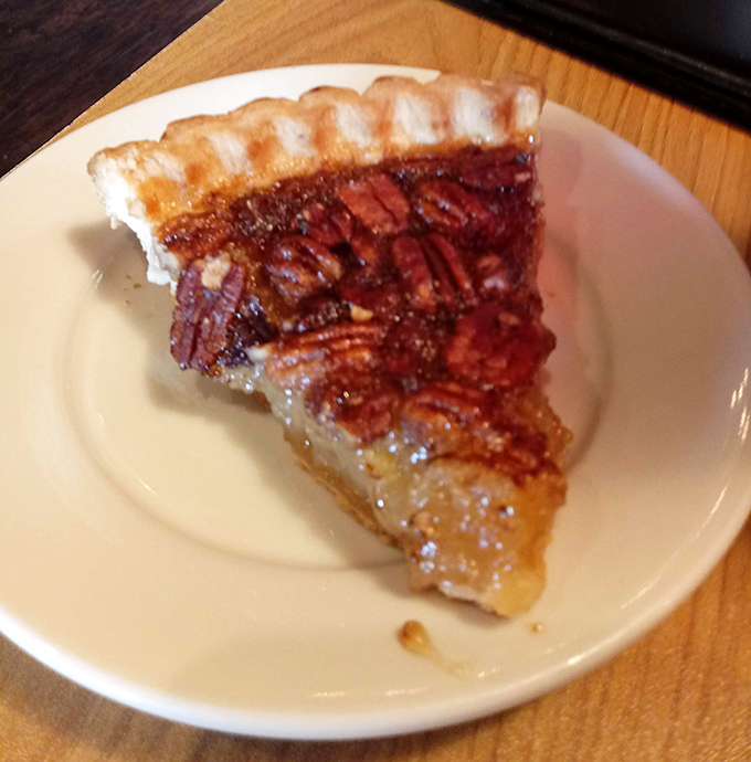 This slice of pecan pie isn't just dessert, it's Southern comfort in triangular form&mdash;the kind of sweet finale that makes you loosen your belt with zero regrets.