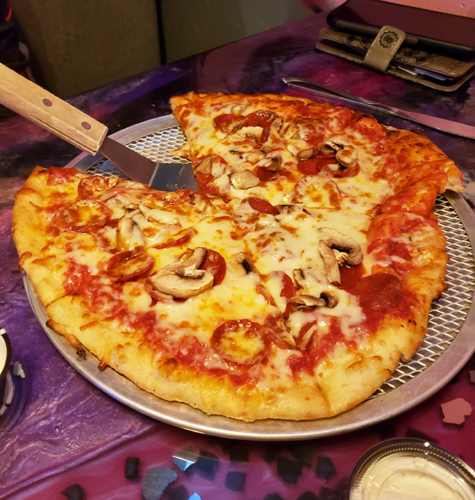 This isn't just pizza &ndash; it's a perfectly proportioned canvas where mushrooms and pepperoni play starring roles in a melty masterpiece.