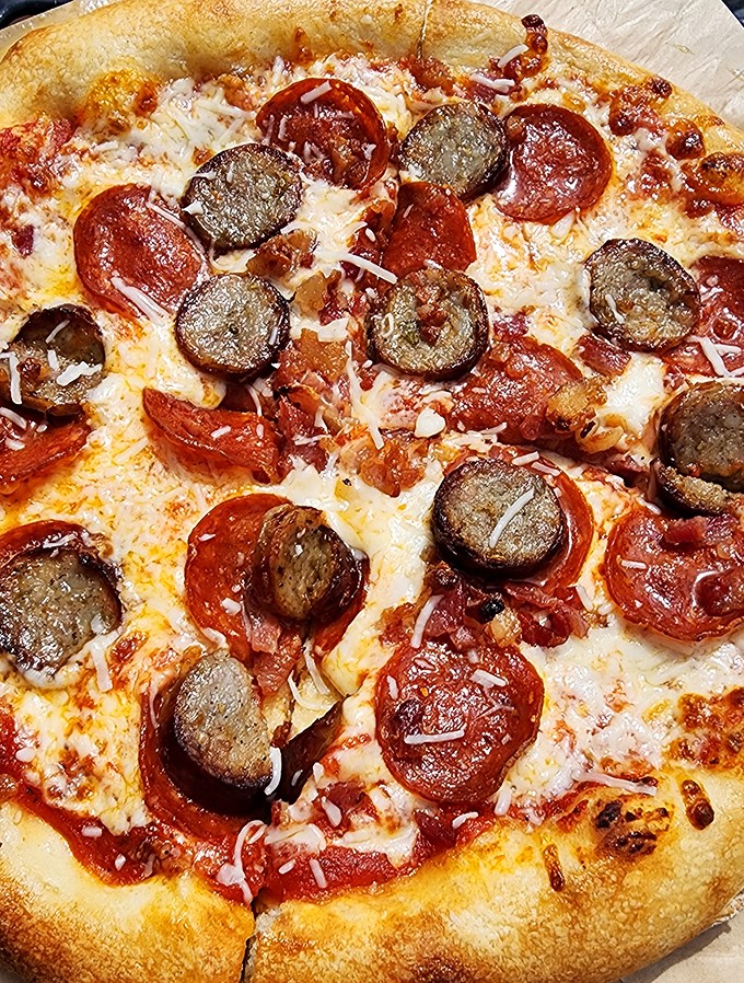 Pizza perfection isn't complicated: just a chewy crust, tangy sauce, and that magical moment when pepperoni curls into tiny flavor cups.