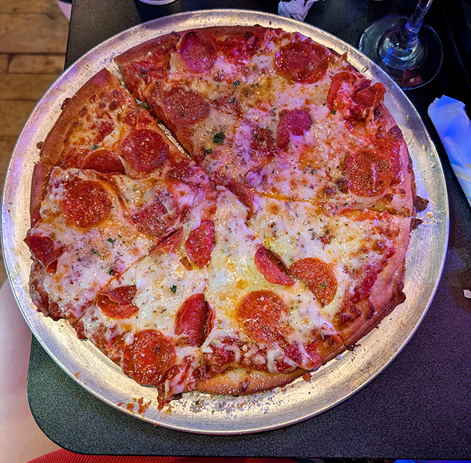 Even the pizza joins the spooky party, proving that pepperoni never looked so mysteriously appetizing.