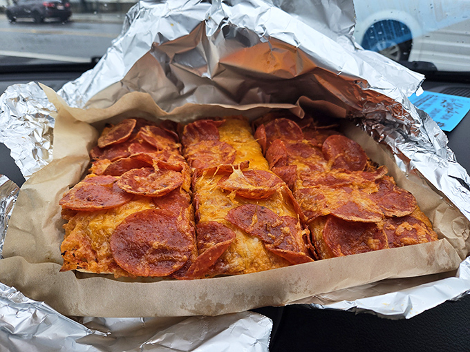 When pizza becomes portable, magic happens - pepperoni perfection you can hold in your hands.