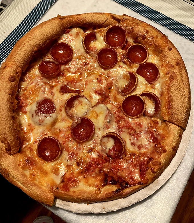 Pepperoni pizza done right - those perfect little grease cups holding pools of spicy, smoky goodness.