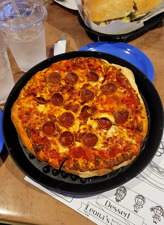 Pizza perfection in cast iron &ndash; those crispy-edged pepperoni cups holding tiny pools of flavor are what food dreams are made of.