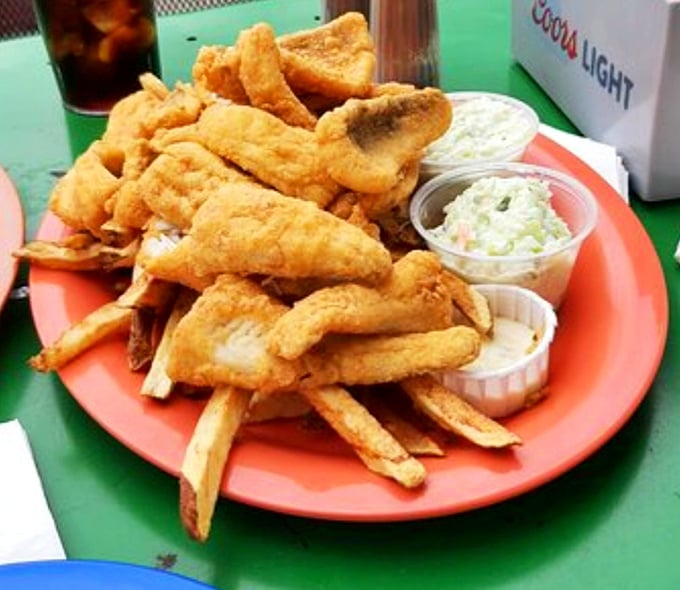 Lake Erie's bounty, transformed into crispy, golden treasures. This perch platter with coleslaw is the kind of meal that makes you wonder why you ever eat anything else.