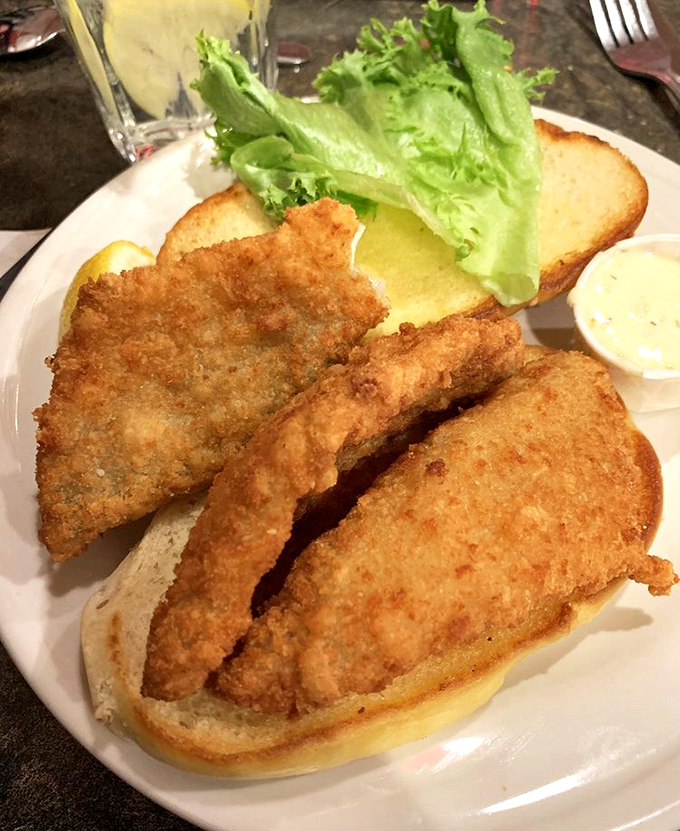 The Lake Erie perch sandwich: crispy, golden perfection nestled between bread that makes you wonder why you'd ever eat anything else.