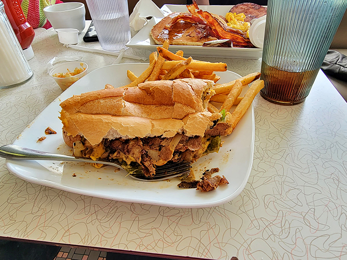 A sandwich so substantial it requires structural engineering. That cheesesteak isn't just a meal&mdash;it's an architectural achievement worthy of Philadelphia's approval.