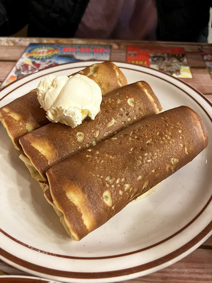 These aren't your average pigs in blankets&mdash;they're breakfast royalty wrapped in golden pancake robes with a dollop of butter crown.