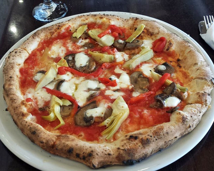 Pizza perfection isn't just about toppings &ndash; it's that magical marriage of mushrooms, artichokes and cheese on a crust that's both cloud and canvas.