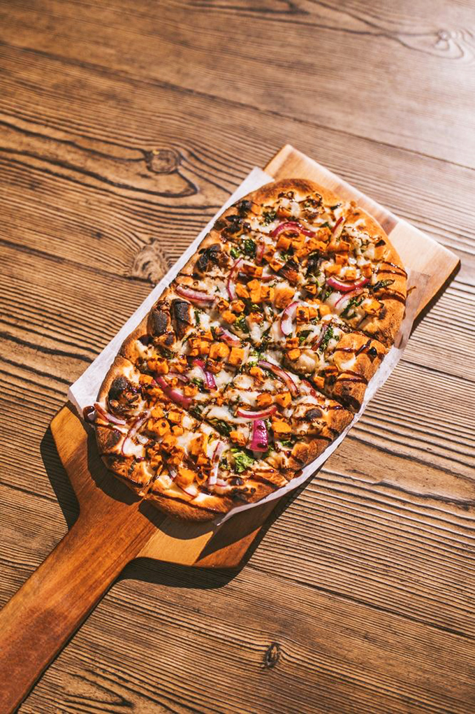 Pizza perfection&mdash;crispy-edged, generously topped, and begging to be folded New York-style while contemplating life's important questions.