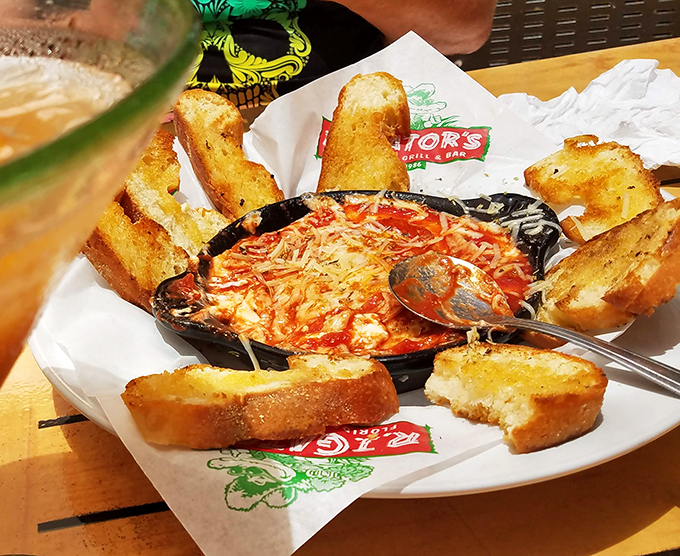 Bubbling cheese dip surrounded by garlic toast soldiers&mdash;a dish that makes sharing both necessary and slightly disappointing when it's gone.