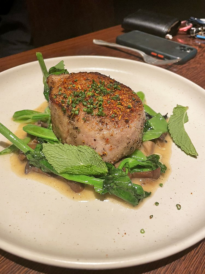 This isn't just a pork chop&mdash;it's pork elevated to its highest calling. Nestled on a bed of greens with a sauce you'll be tempted to drink straight.