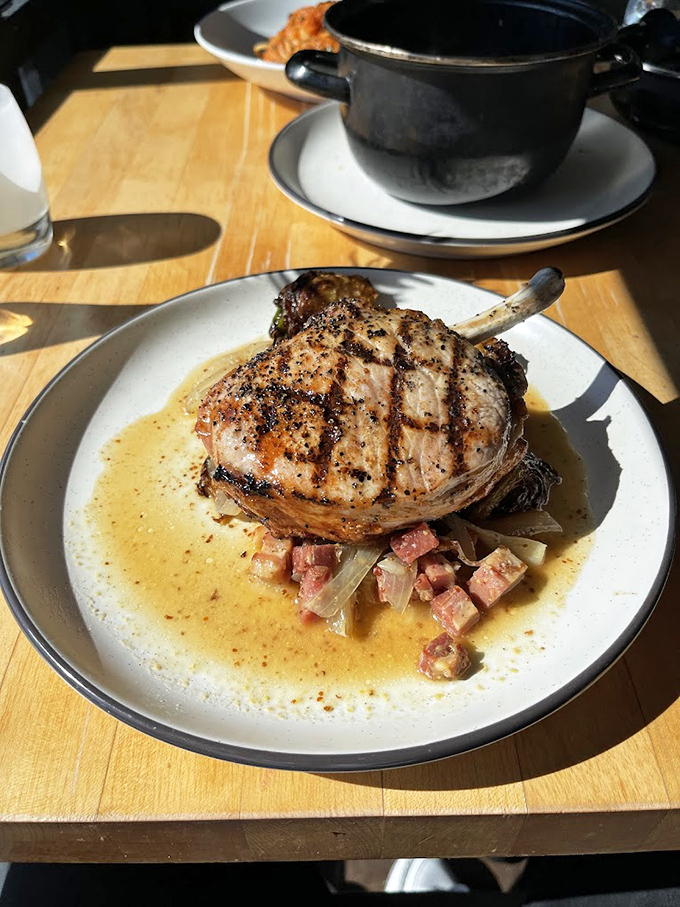 Not just a pork chop &ndash; it's a bone-in masterpiece swimming in a sauce that would make even vegetarians consider conversion.