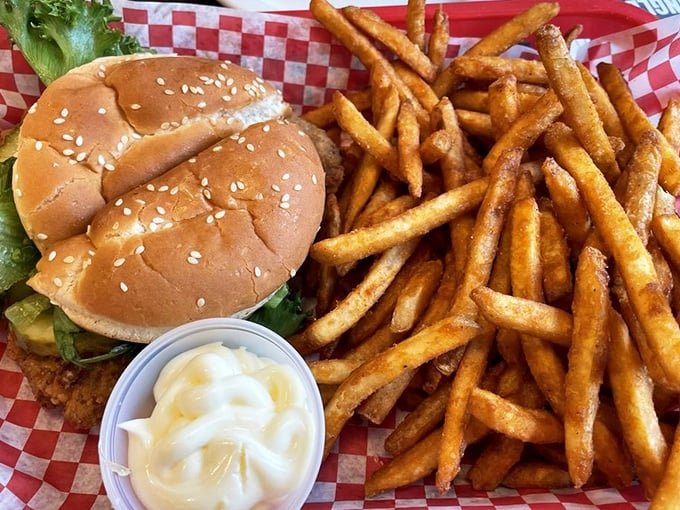 A proper pork tenderloin sandwich should always require a passport to travel from one edge of the bun to the other. 