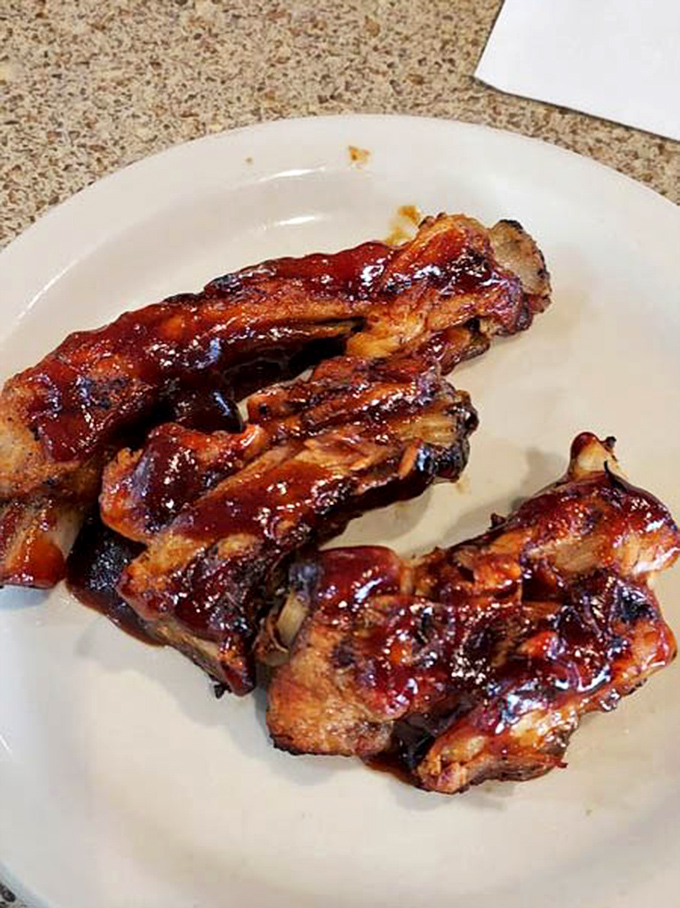 BBQ ribs glistening with sauce that's traveled to all the right places &ndash; sticky fingers are the price of admission to flavor town.