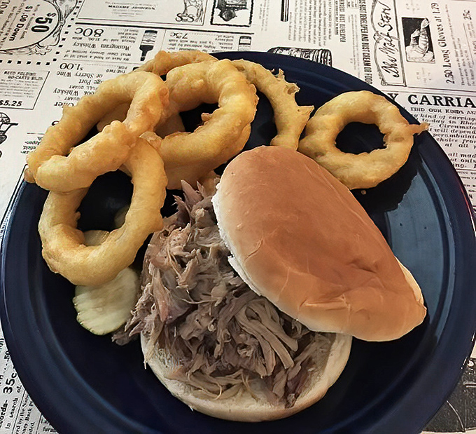 The pulled pork sandwich with onion rings&mdash;a partnership more perfect than peanut butter and jelly, or Batman and Robin.