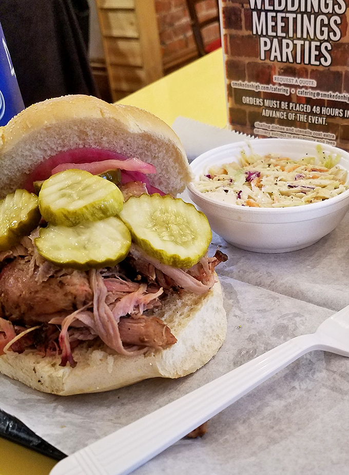 This pulled pork sandwich with pickles and slaw isn't just lunch&mdash;it's what happiness would look like if it took physical form.
