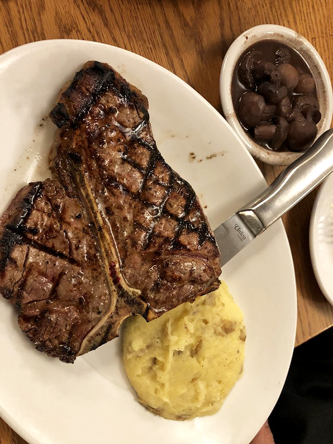 This porterhouse doesn't just sit on the plate&mdash;it commands it, with those mushrooms and sauce playing delicious supporting roles.