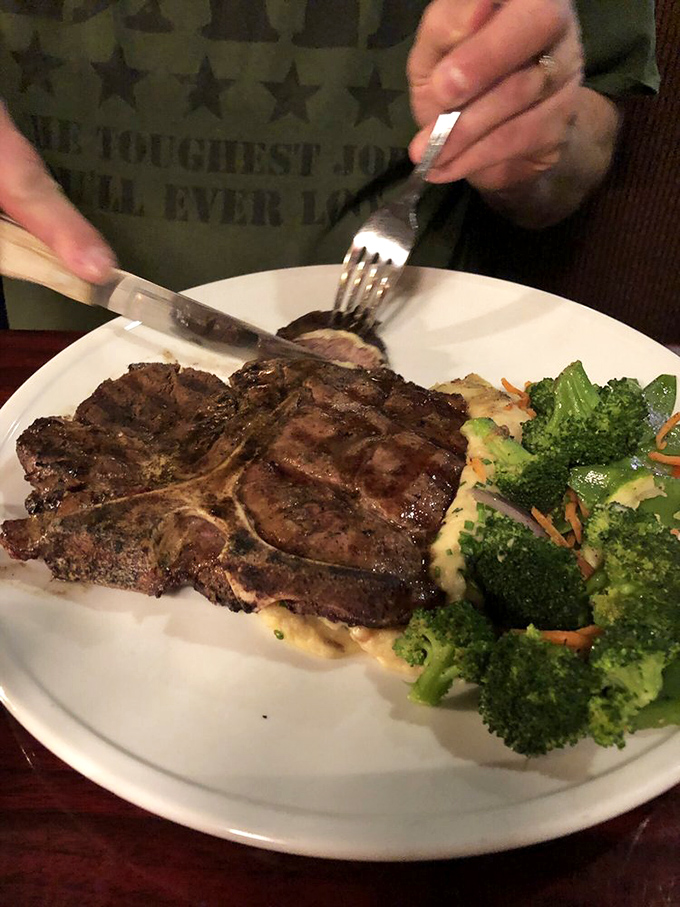 When a porterhouse steak arrives looking like this, conversation stops, forks ready themselves, and suddenly nothing else in the world matters.