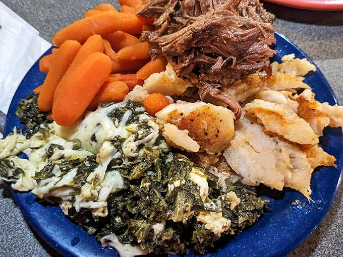 A blue plate special that tells the story of Tennessee on one dish: tender pot roast, creamy spinach, and carrots that actually taste like carrots.
