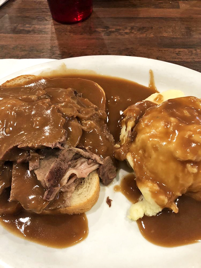 Pot roast swimming in gravy so rich it probably has its own accountant. Comfort food that hugs your soul from the inside.