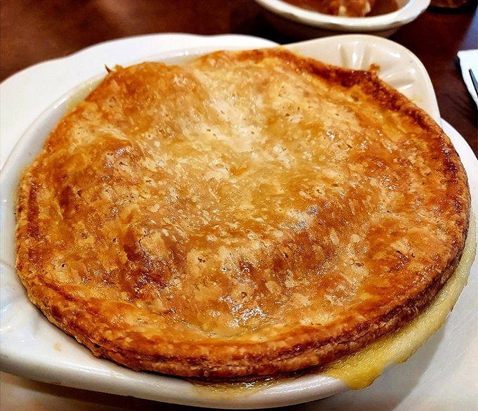 The chicken pot pie arrives like comfort in a ceramic boat &ndash; a flaky-topped vessel sailing through a sea of "I needed this today."