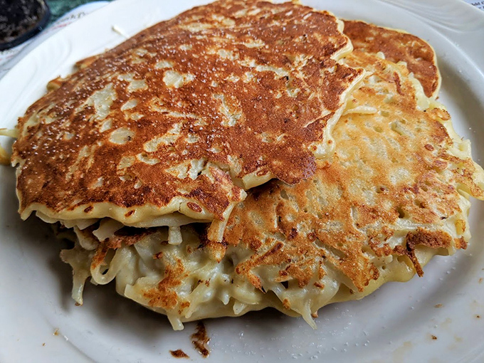 Potato pancakes with their crispy, lacy edges are what hash browns dream of becoming when they grow up.