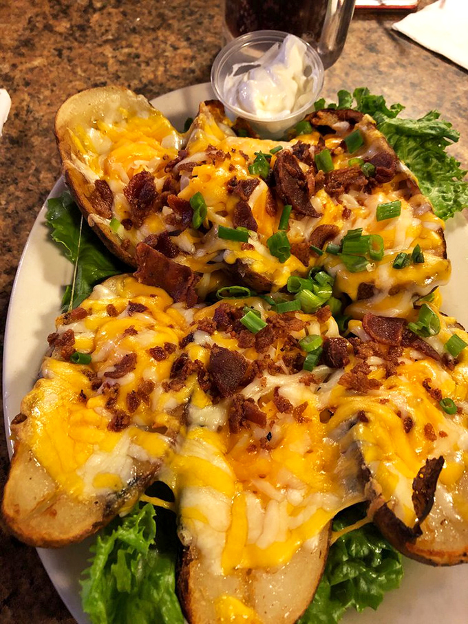 Loaded potato skins that don't mess around&mdash;cheese melted to perfection, bacon bits aplenty, and green onions adding that perfect fresh finish.