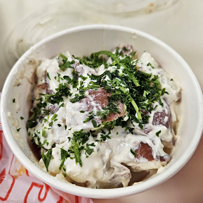 Potato salad dressed to the nines with herbs &ndash; the cool cousin at the spicy family reunion.