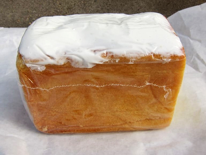 That white-iced pound cake sits there like it knows it's about to ruin your diet.