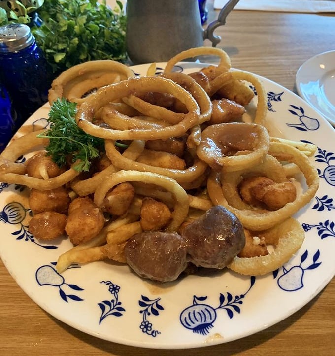 A plate that answers the question: "What if onion rings and Swedish meatballs had a delicious family reunion?" Pure comfort on traditional blue-patterned china.