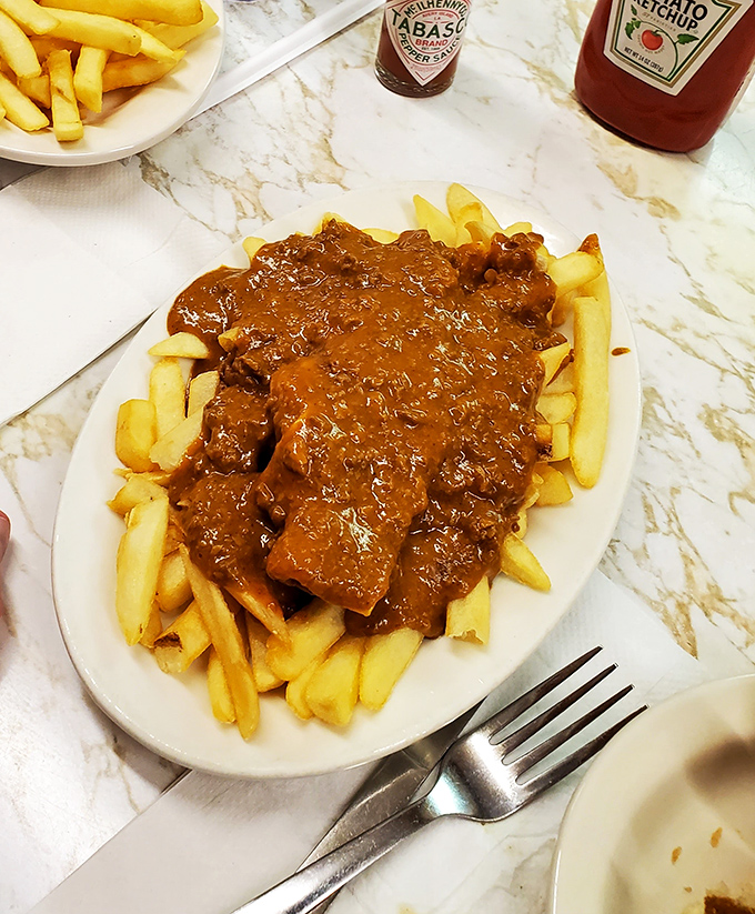 Chili cheese fries: where crispy potatoes meet meaty sauce in a relationship so perfect it should have its own romance novel.