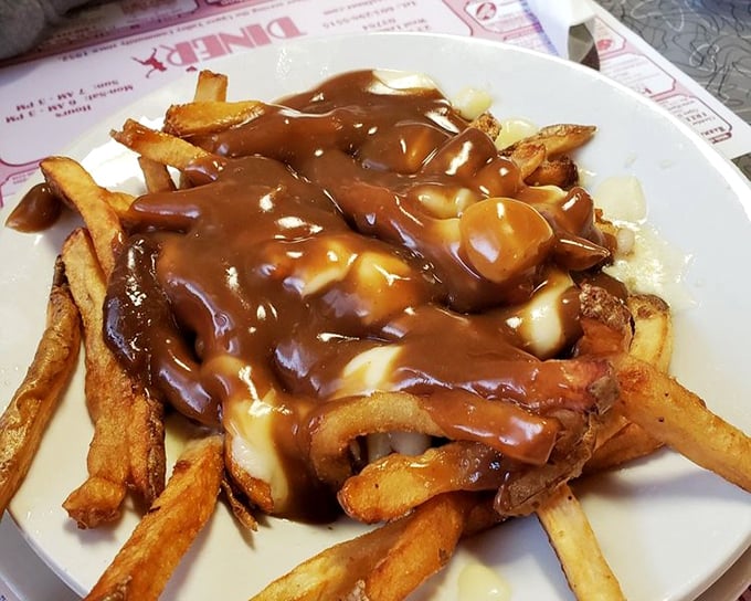 Poutine that doesn't need a passport&mdash;golden fries swimming in gravy and cheese curds that would make a Canadian shed a patriotic tear.