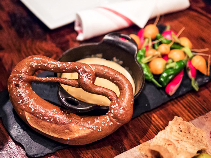 The humble pretzel reimagined as royalty, served with mustard that's clearly been to culinary finishing school.
