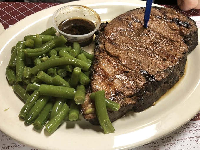 A steak that doesn't need a fancy steakhouse setting to shine. Those green beans aren't just a garnish&mdash;they're fighting for the spotlight.